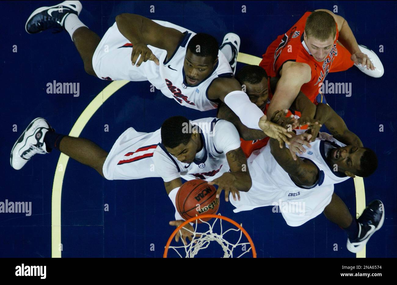 Mississippi center Demarco Cox, top left, and forward Murphy Holloway ...
