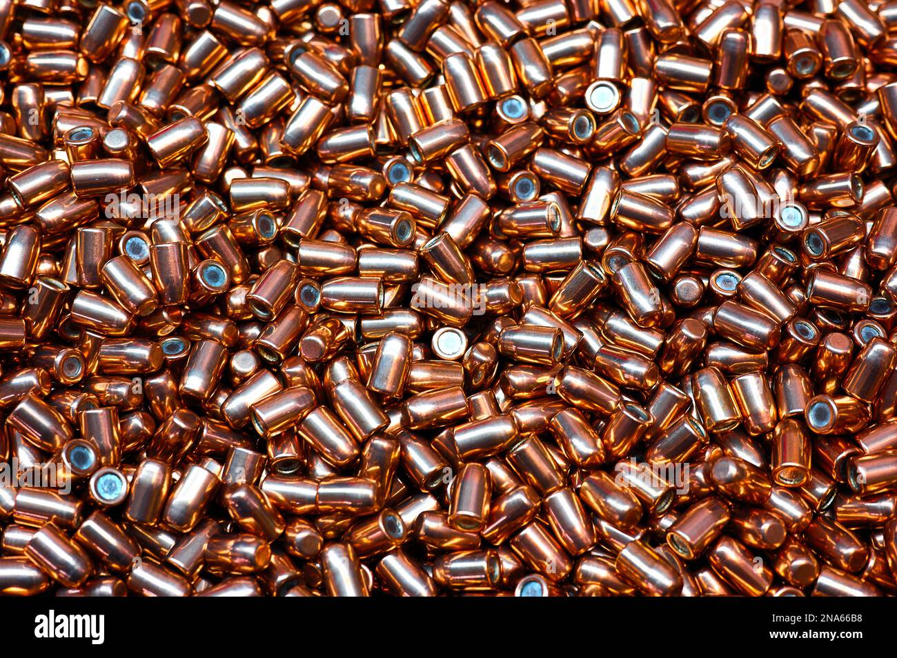 Sparkling golden bullets heap for firearms as background Stock Photo ...