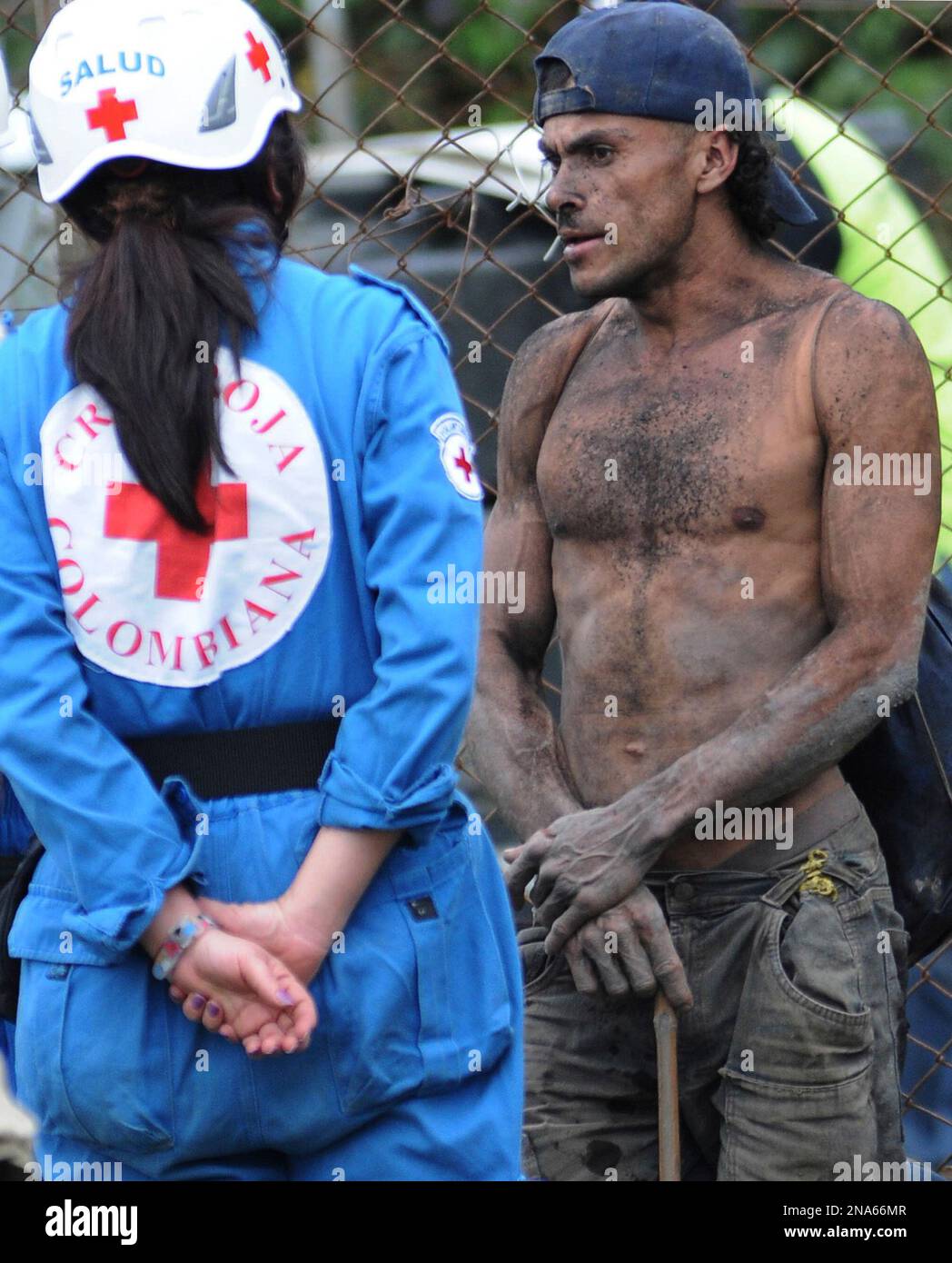 A miner speaks to a paramedic outside "El Desespero" coal mine in ...