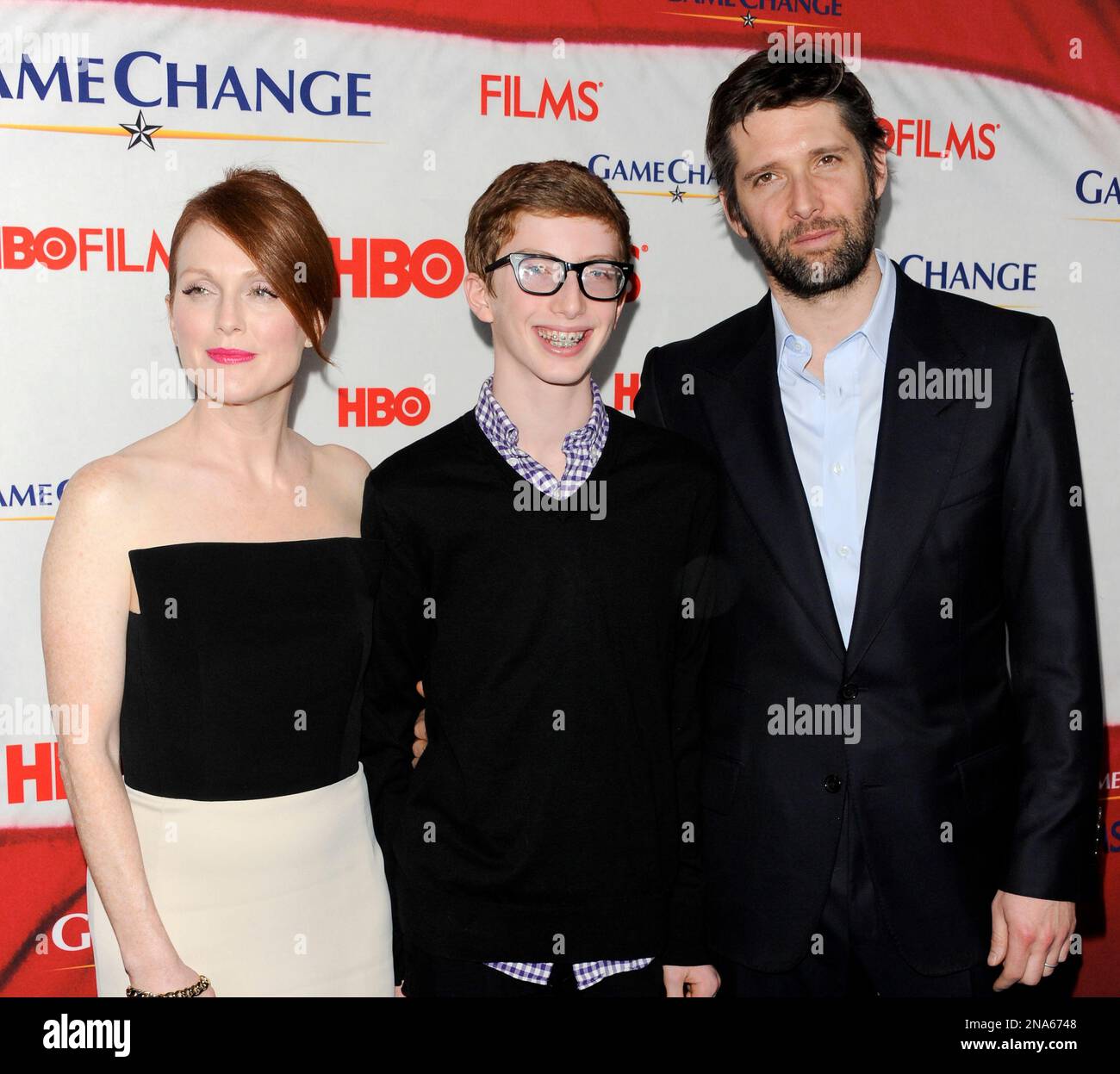 Actress Julianne Moore poses as husband Bart Freundlich and son Caleb ...