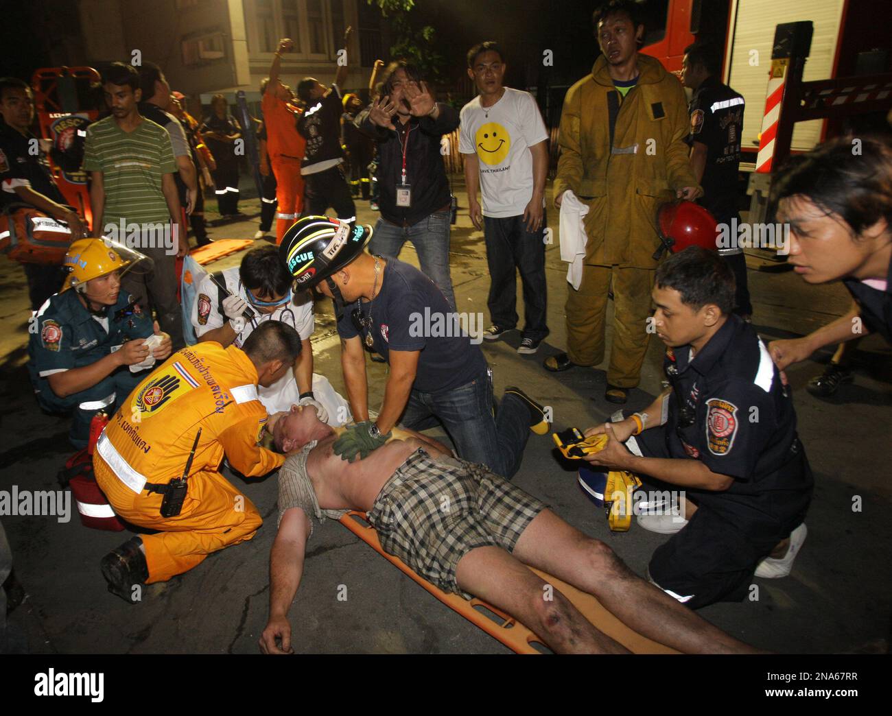 Thai firefighters pump cardiopulmonary resuscitation fire victim form ...
