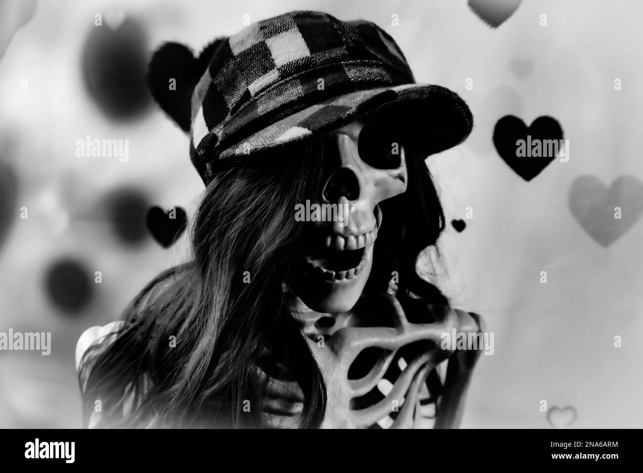 Black and white of a happy Female Skeleton Wearing a long brown wig and ...