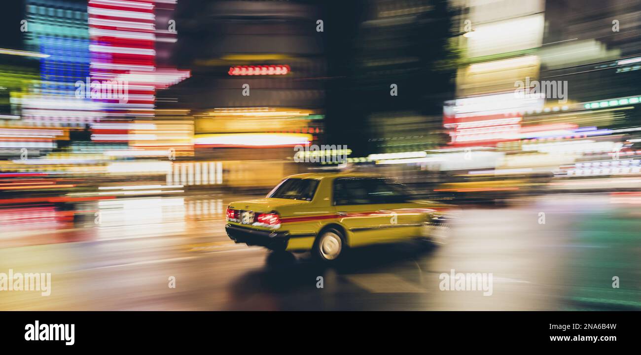 Taxi panning in Shinjuku street at night, Tokyo, Japan Stock Photo - Alamy
