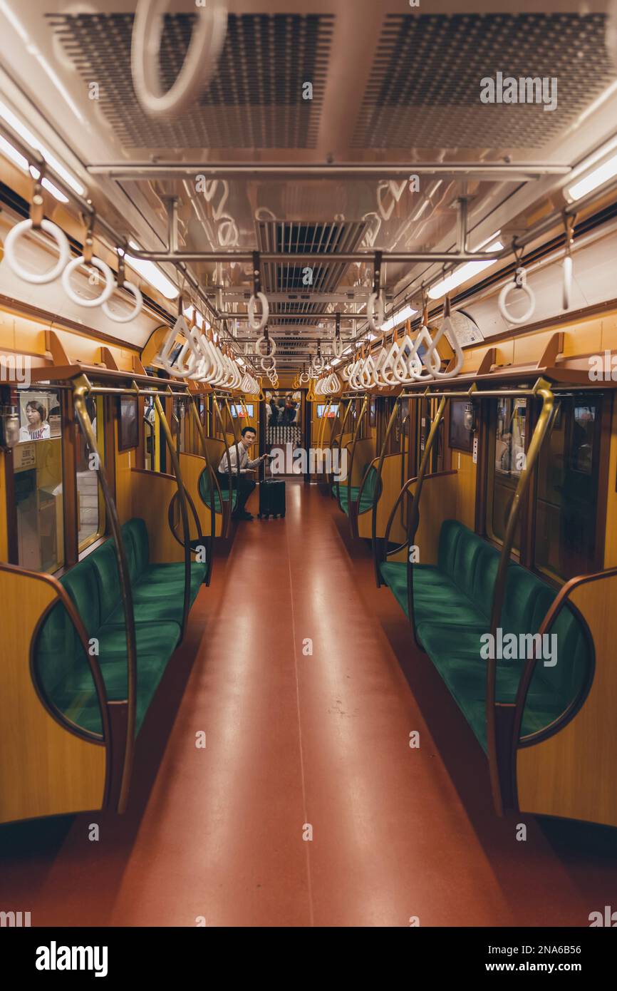 Asian people sitting in subway hi-res stock photography and images - Alamy