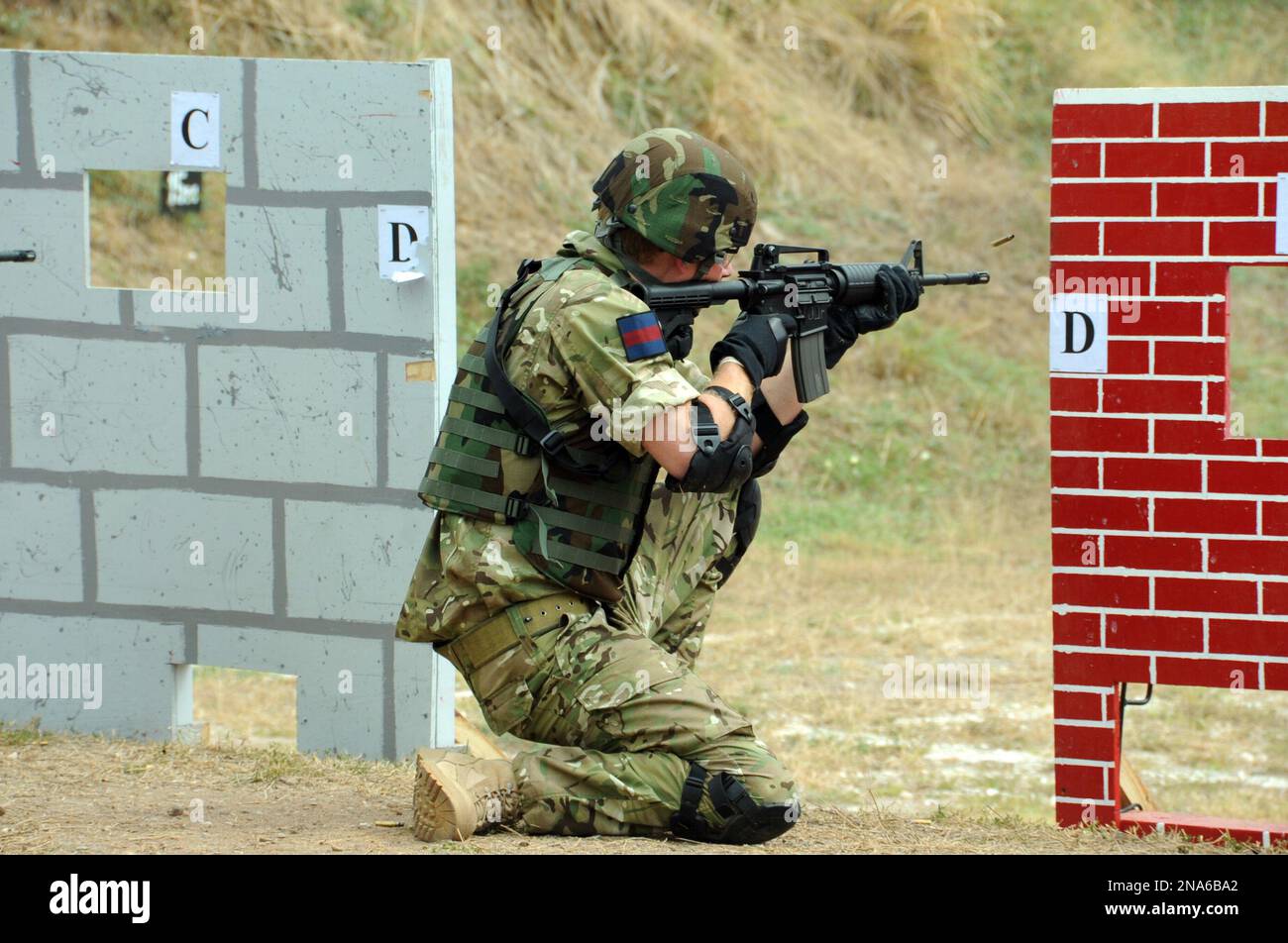 Britain's Prince Harry fire with a M4 rifle during a target practice at ...