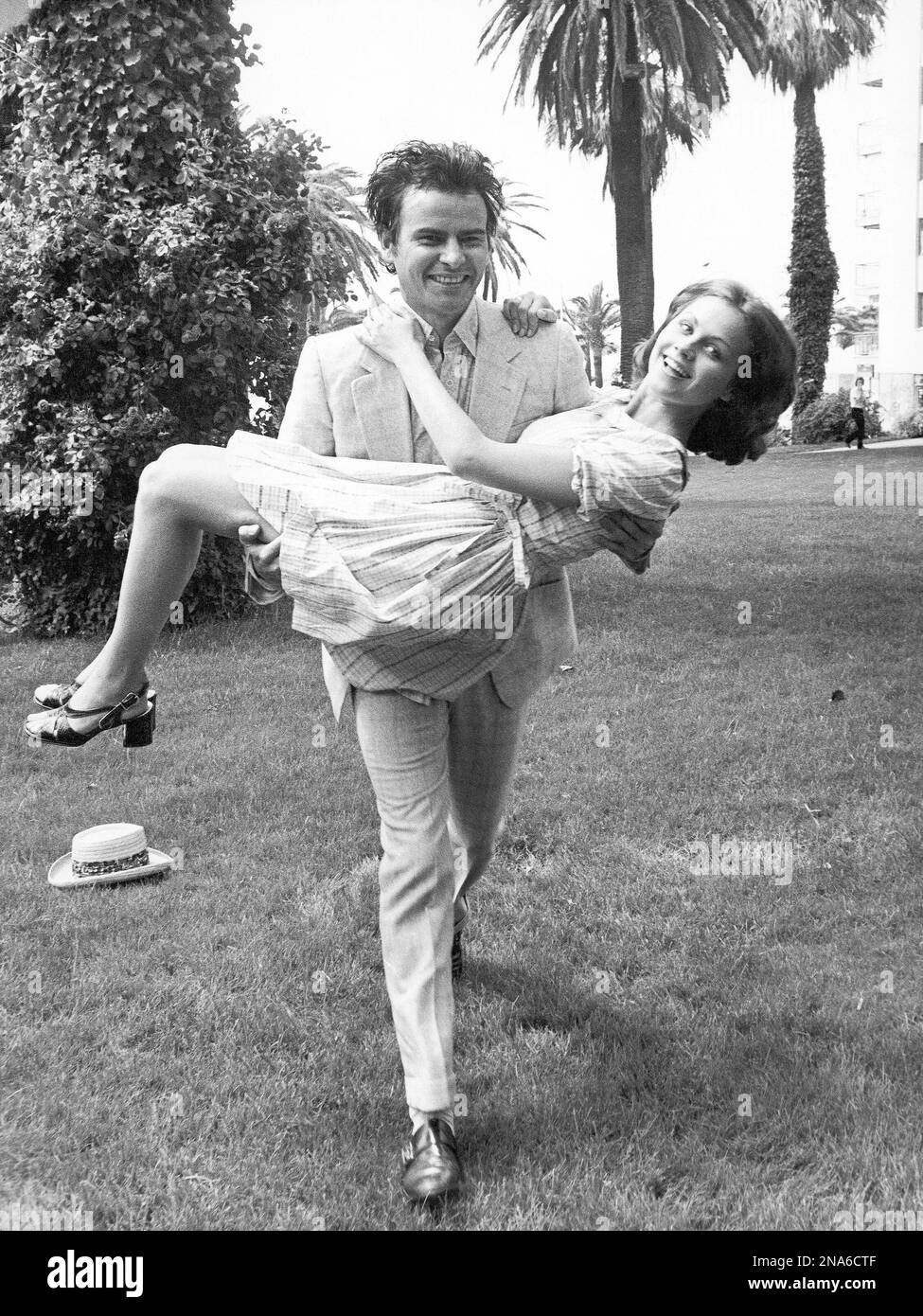 French actress Muriel Catala carried by German actor Horst Buchholz ...