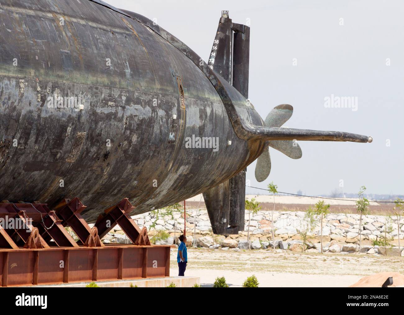 A visitor looks at the rudder section of the decommissioned Agosta 70 ...