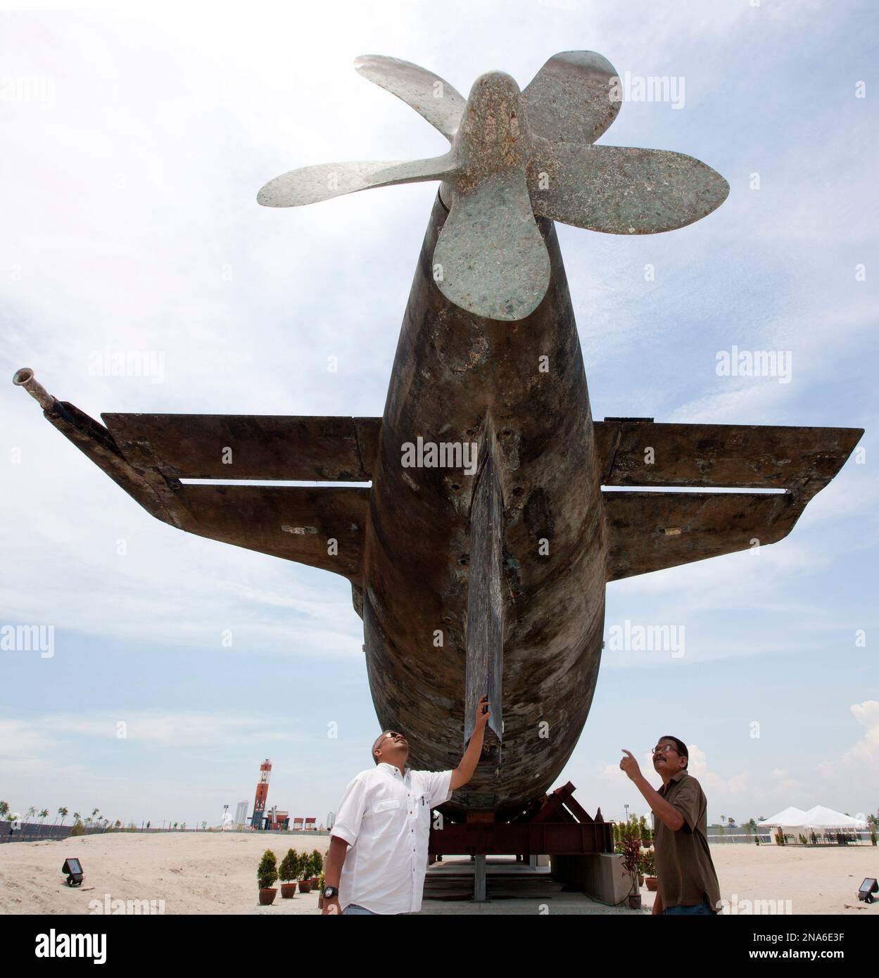 Visitors look at the rudder section of the decommissioned Agosta 70 ...