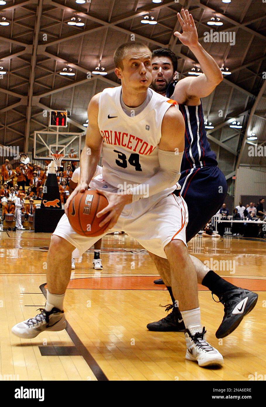 Princeton's Ian Hummer (34) looks to shoot around Pennsylvania's Rob ...