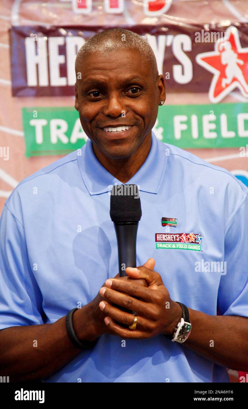Olympic legend Carl Lewis (C) celebrates HERSHEY'S Track & Field Games ...