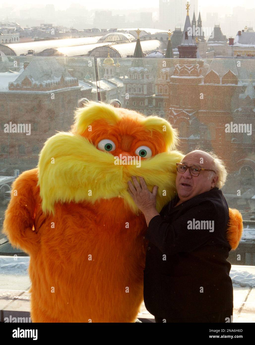 Actor Danny DeVito poses with The Lorax figure during a photo session ...