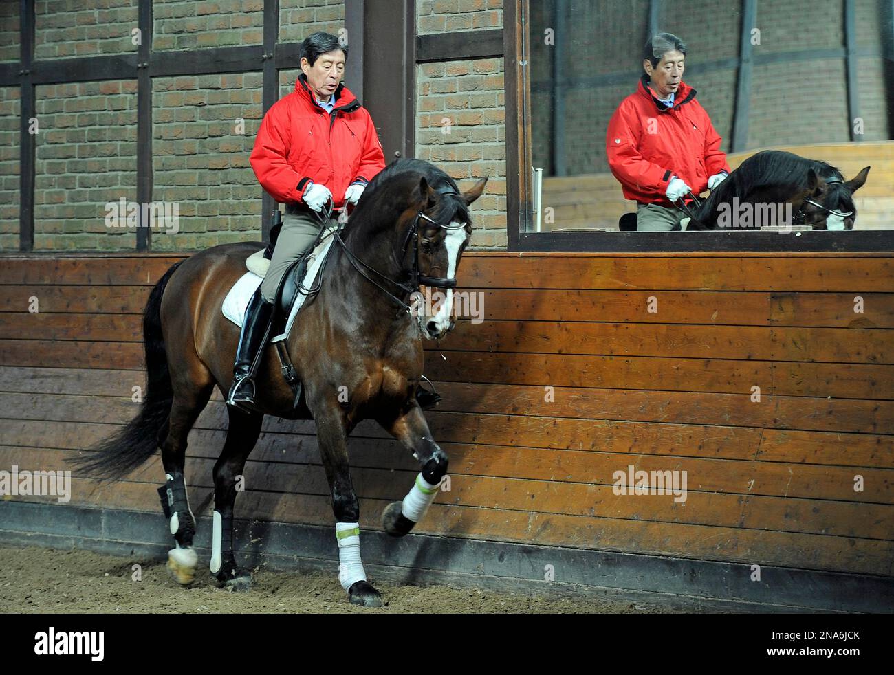 Japan's oldest Olympian Hiroshi Hoketsu exercises at a horse riding ...