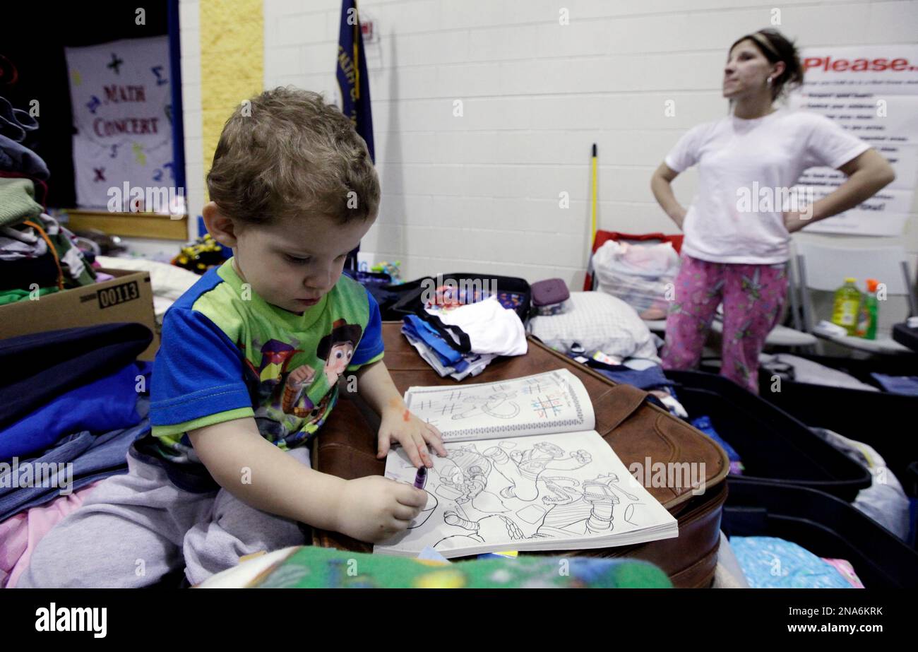 James Daniel Lemaster II, 2, works on coloring a book as his mom Stacy ...