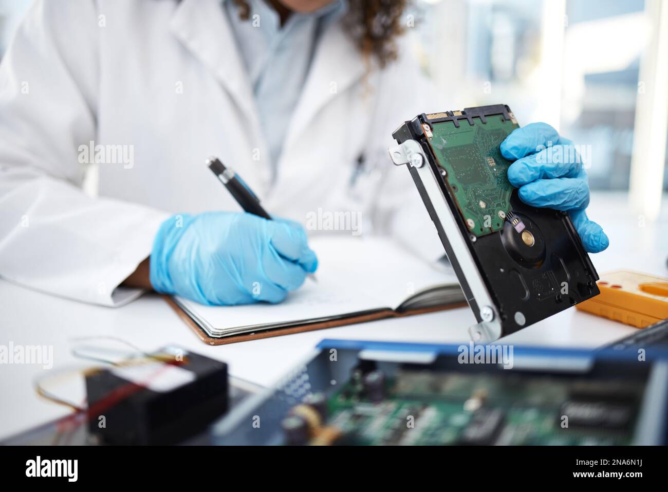 Hands, technician and motherboard from computer, laptop or pc in cyber ...