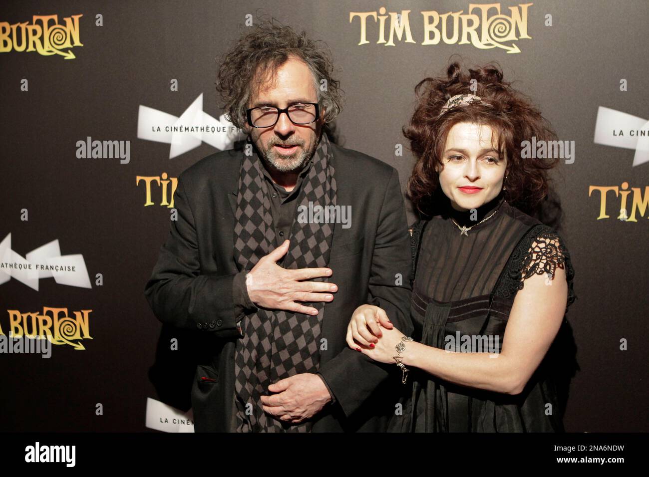 Filmmaker Tim Burton, left, and his wife Helena Bonham-Carter, pose as ...