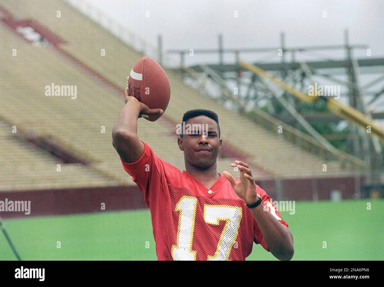 Florida State University quarterback Charlie Ward (17) is shown tossing ...
