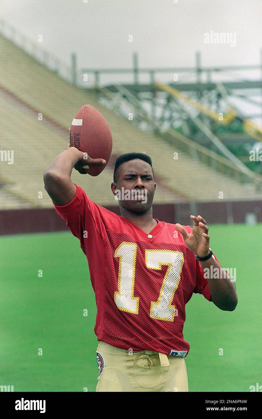 Florida State University quarterback Charlie Ward (17) is shown tossing ...