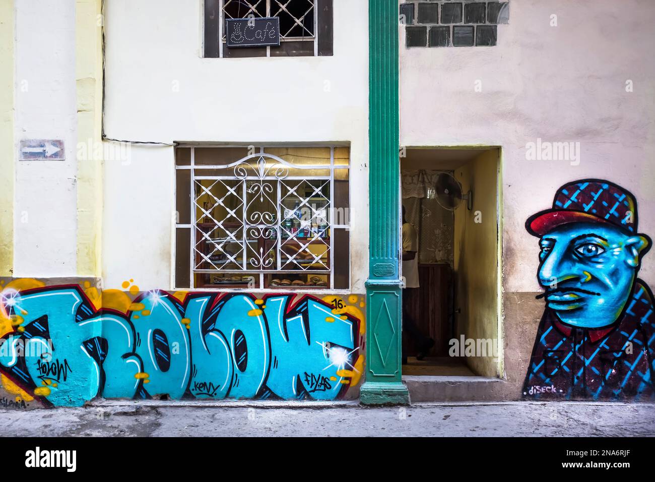 Street scenes through the old city of Havana, with graffiti painted on ...