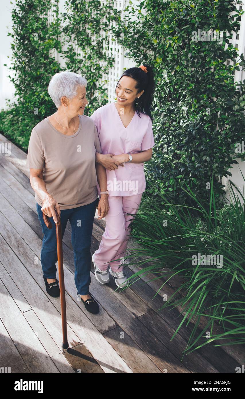 Old woman using a walking stick hi-res stock photography and images - Alamy