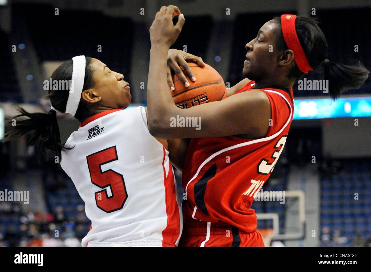 St. John's Nadirah McKenith (5) and Louisville's Asia Taylor, right ...
