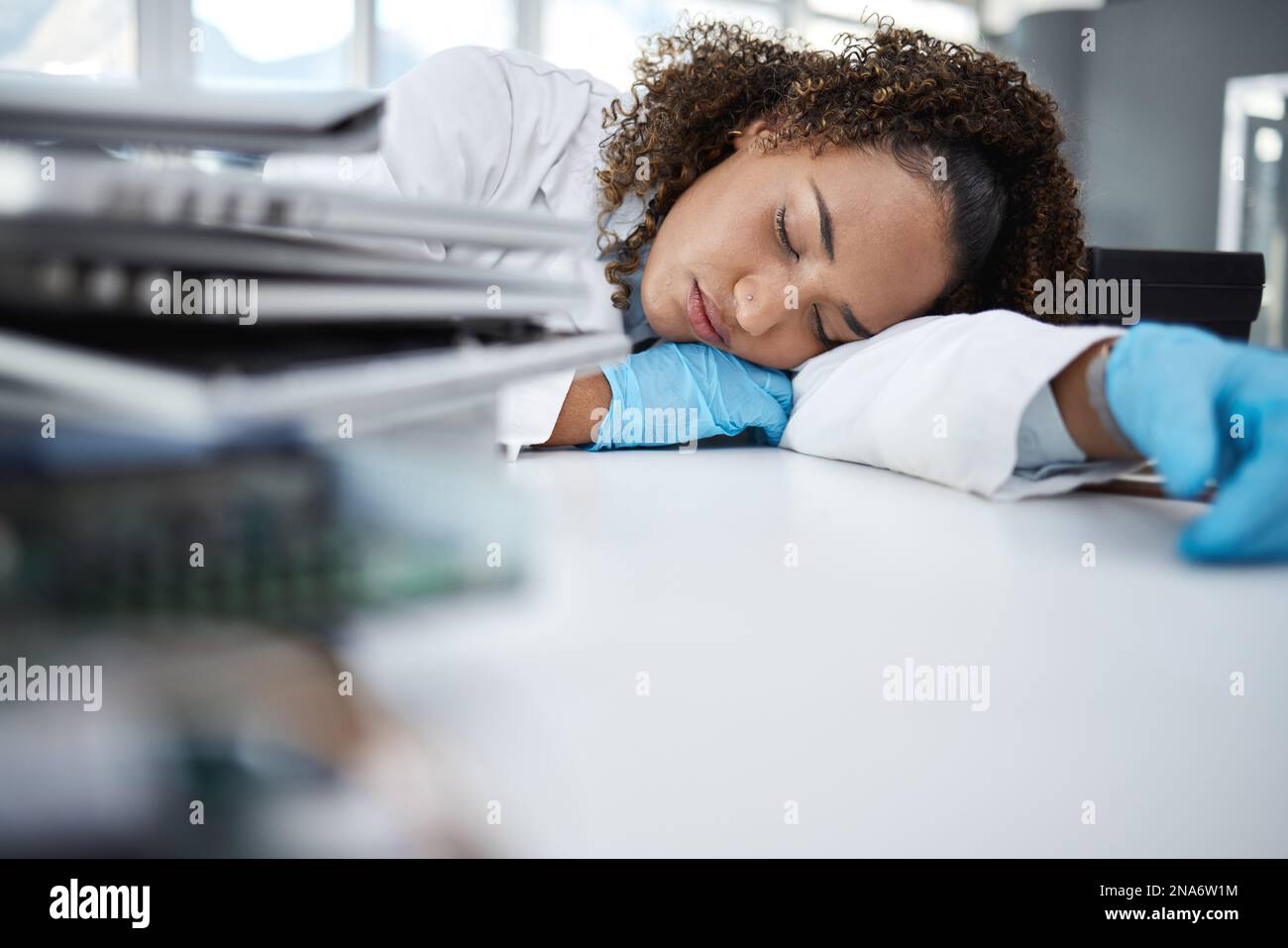Science, exhausted and scientist taking nap in lab after working on ...