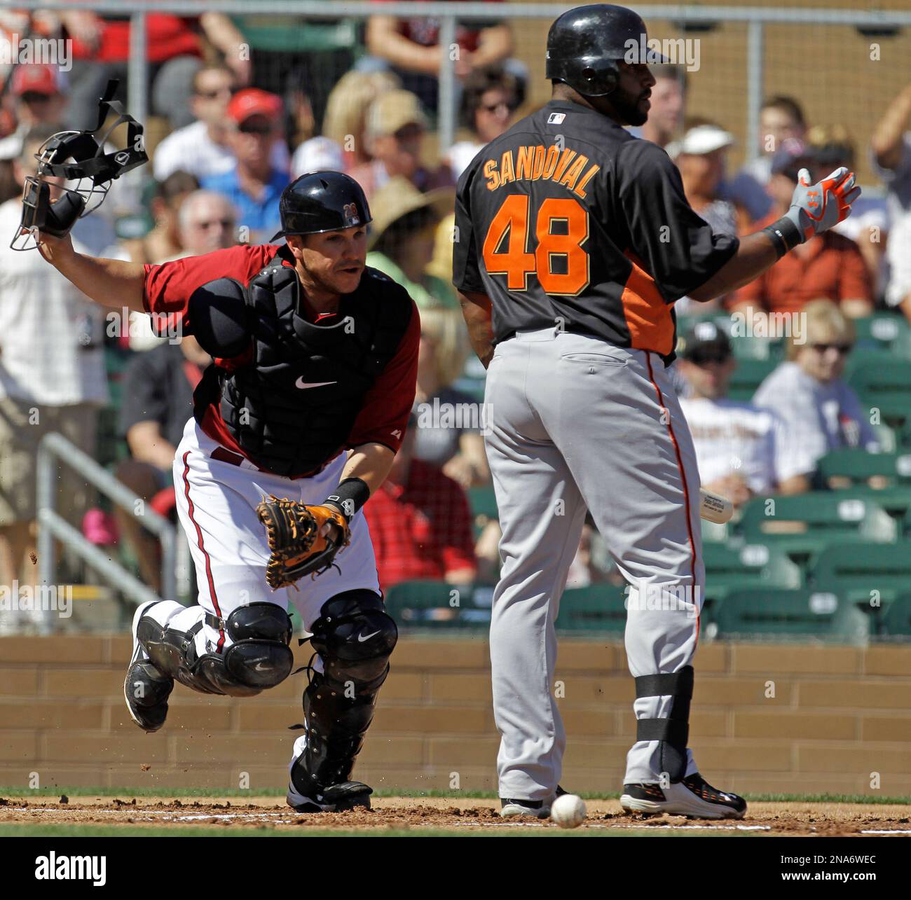 Arizona Diamondbacks' Miguel Montero, left, chases down the ball as San ...