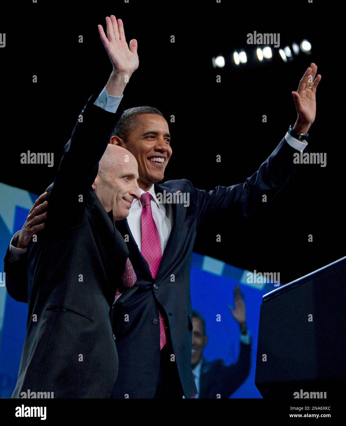 President Barack Obama waves to the crowd with AIPAC's president Lee ...