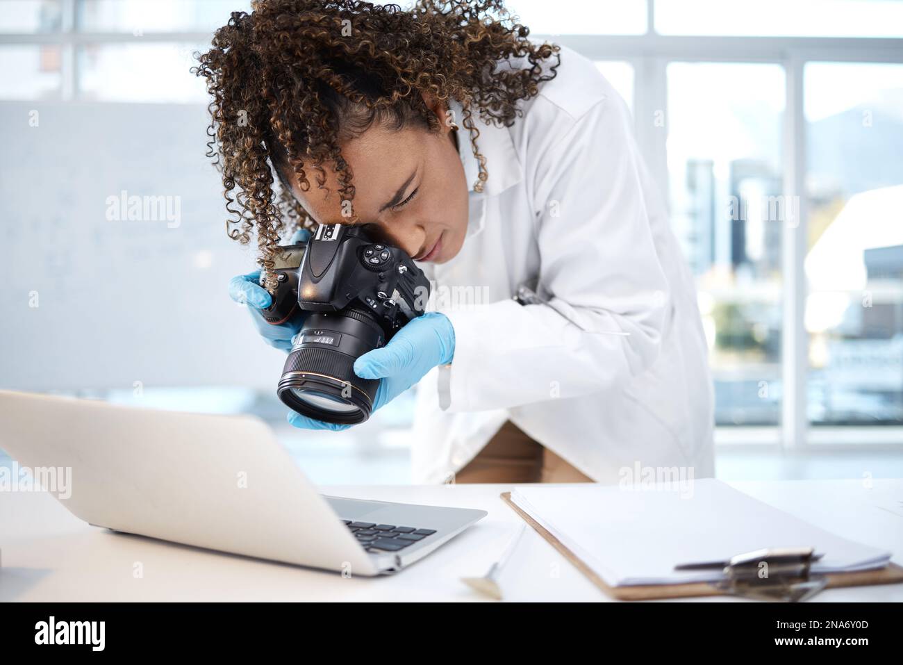 Medical investigation, camera and black woman with laptop in laboratory ...