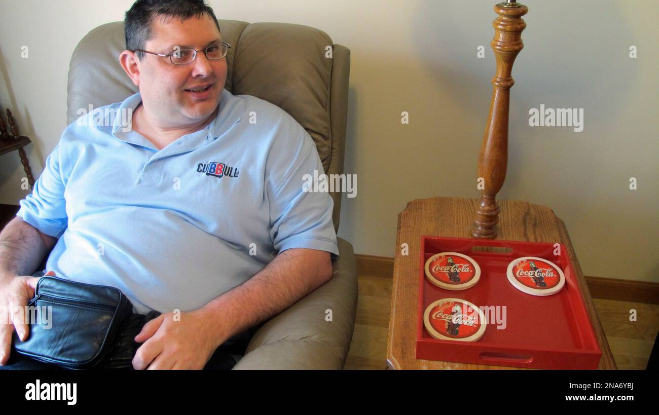 In this photo taken march 1, 2012, Bryan Barnhart, 35, sits in his ...