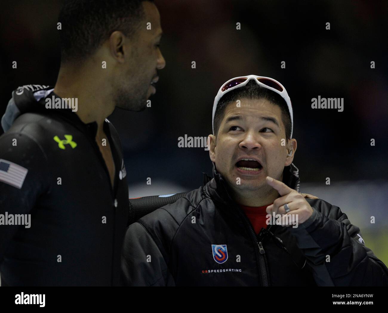 American speed skating coach Ryan Shimabukuro, right, talks to Shani ...