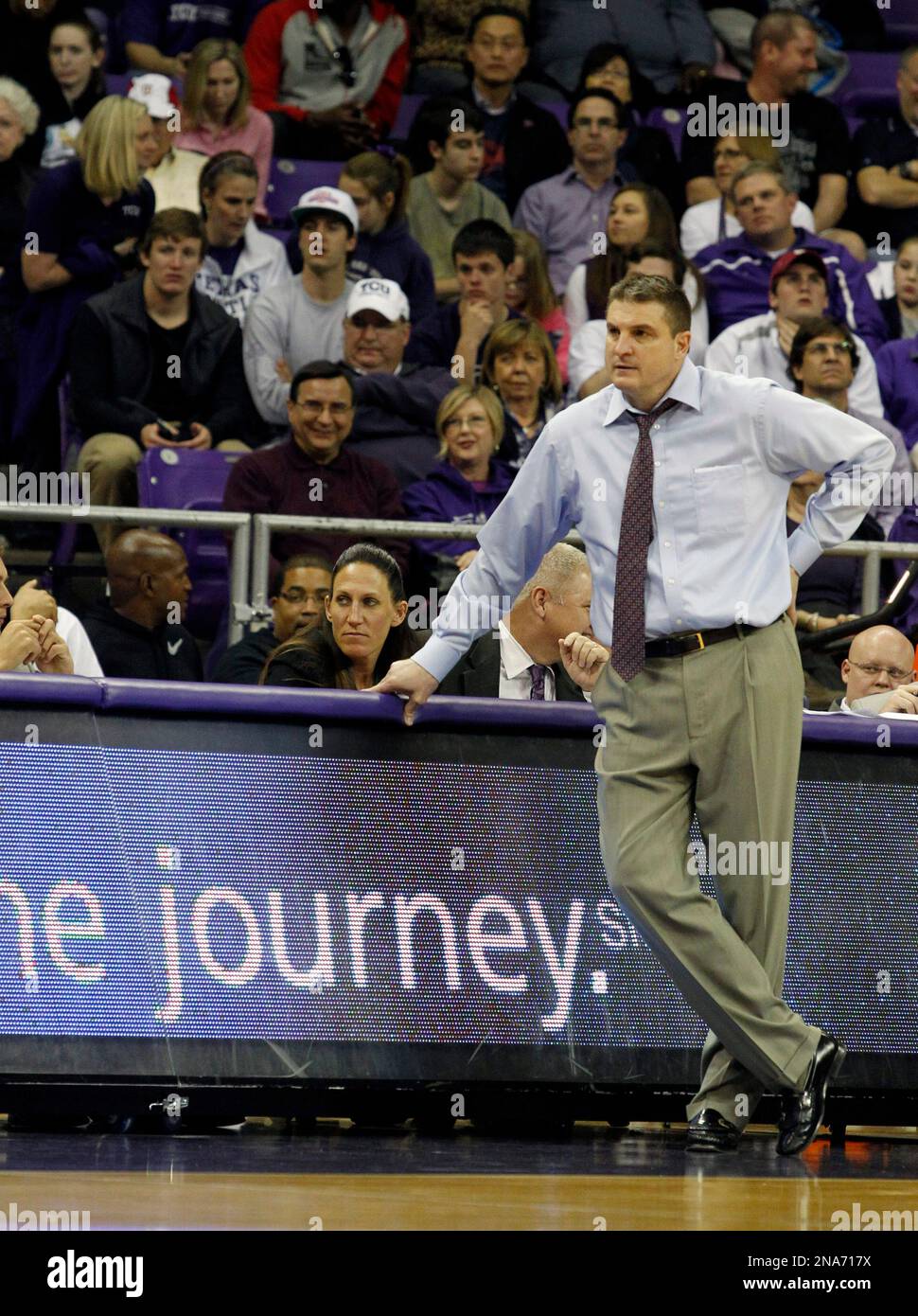 TCU head coach Jim Christian leans on the scorer's table in the second ...