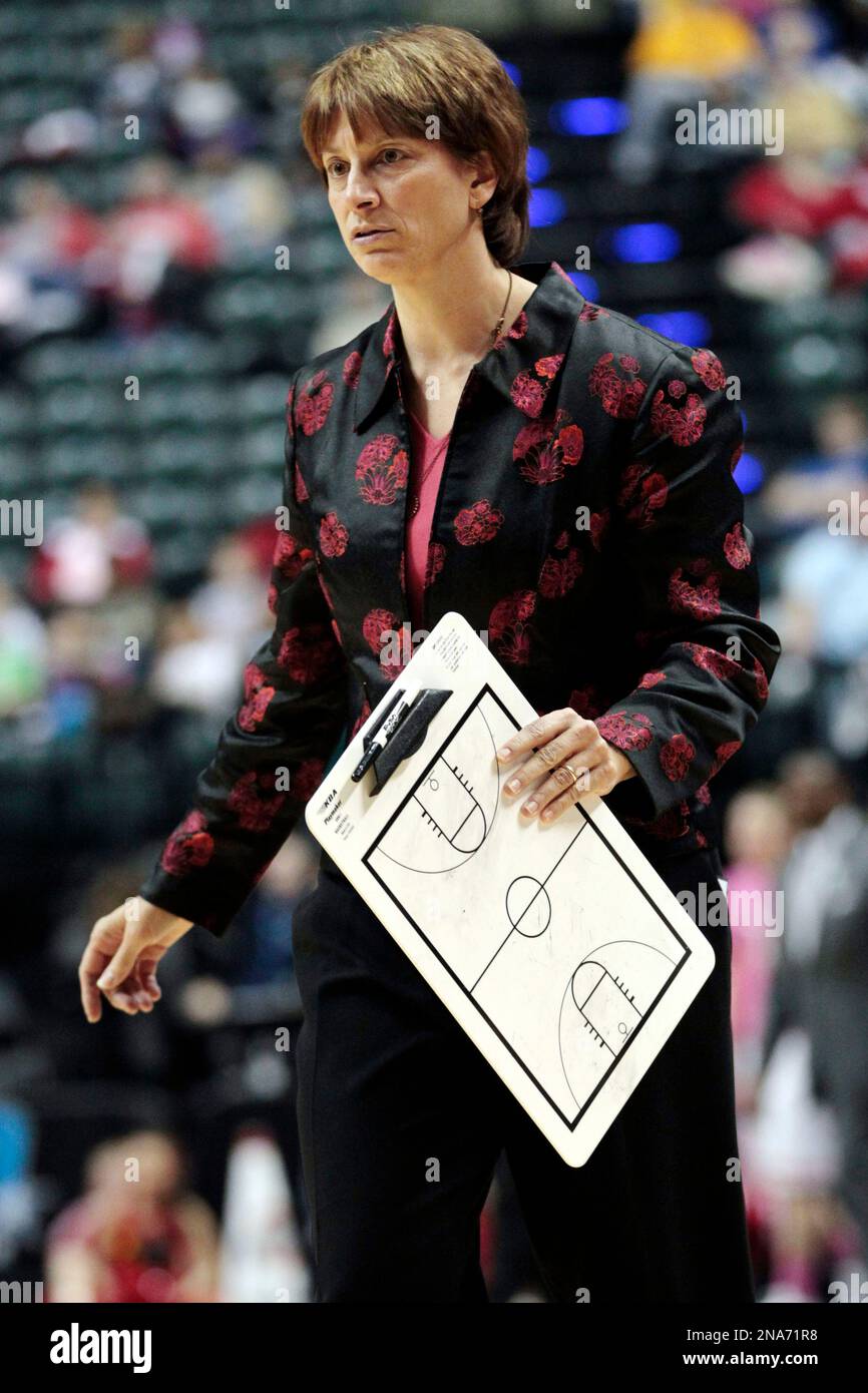 Nebraska head coach Connie Yori grabs a clipboard going into a timeout ...