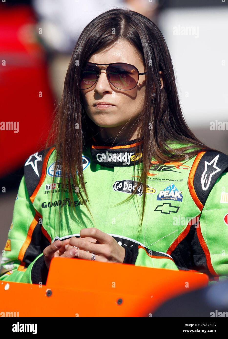 Danica Patrick waits by her car for her turn to run qualifying laps for ...