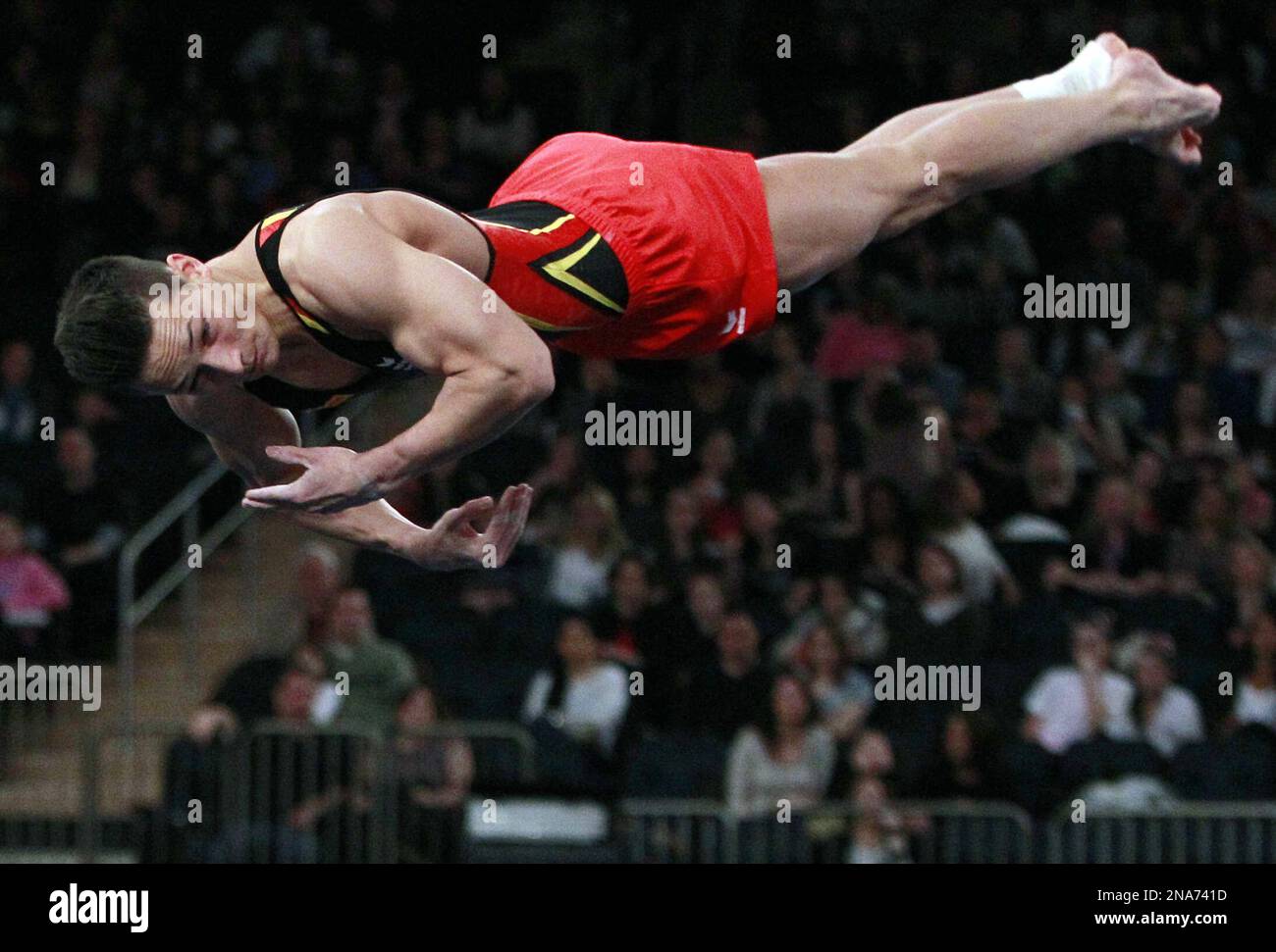 Marcel Nguyen, of Germany, competes in the floor exercise during the ...
