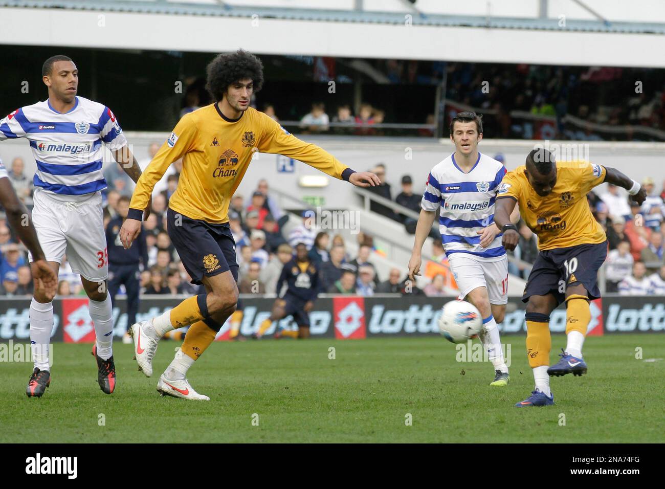 Everton's Royston Drenthe, right, shoots to score against Queens Park ...