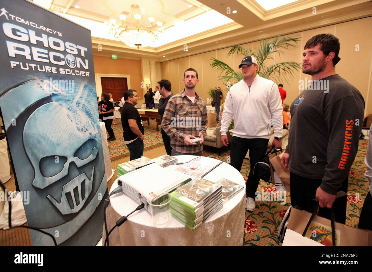 Eric Wood, center, Andy Levitre visit the Athletes First Classic ...