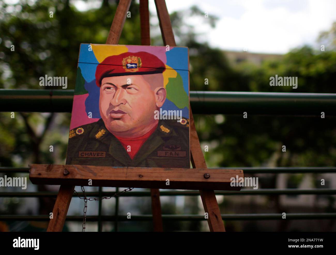 A painting of Venezuela's President Hugo Chavez sits for sale on an ...