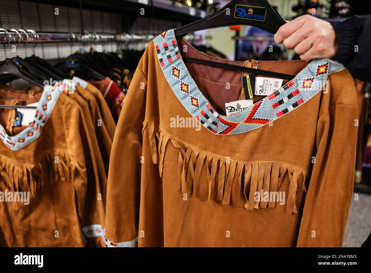 Cologne, Germany. 06th Feb, 2023. A man holds a costume to dress up as ...