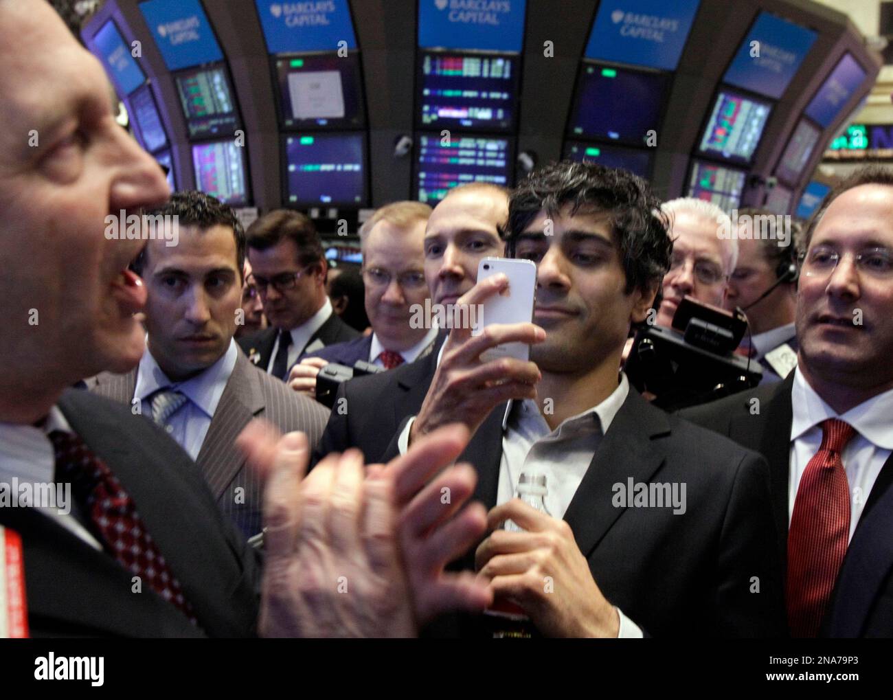 Jeremy Stoppelman, second from right, Yelp co-founder and CEO, uses his ...