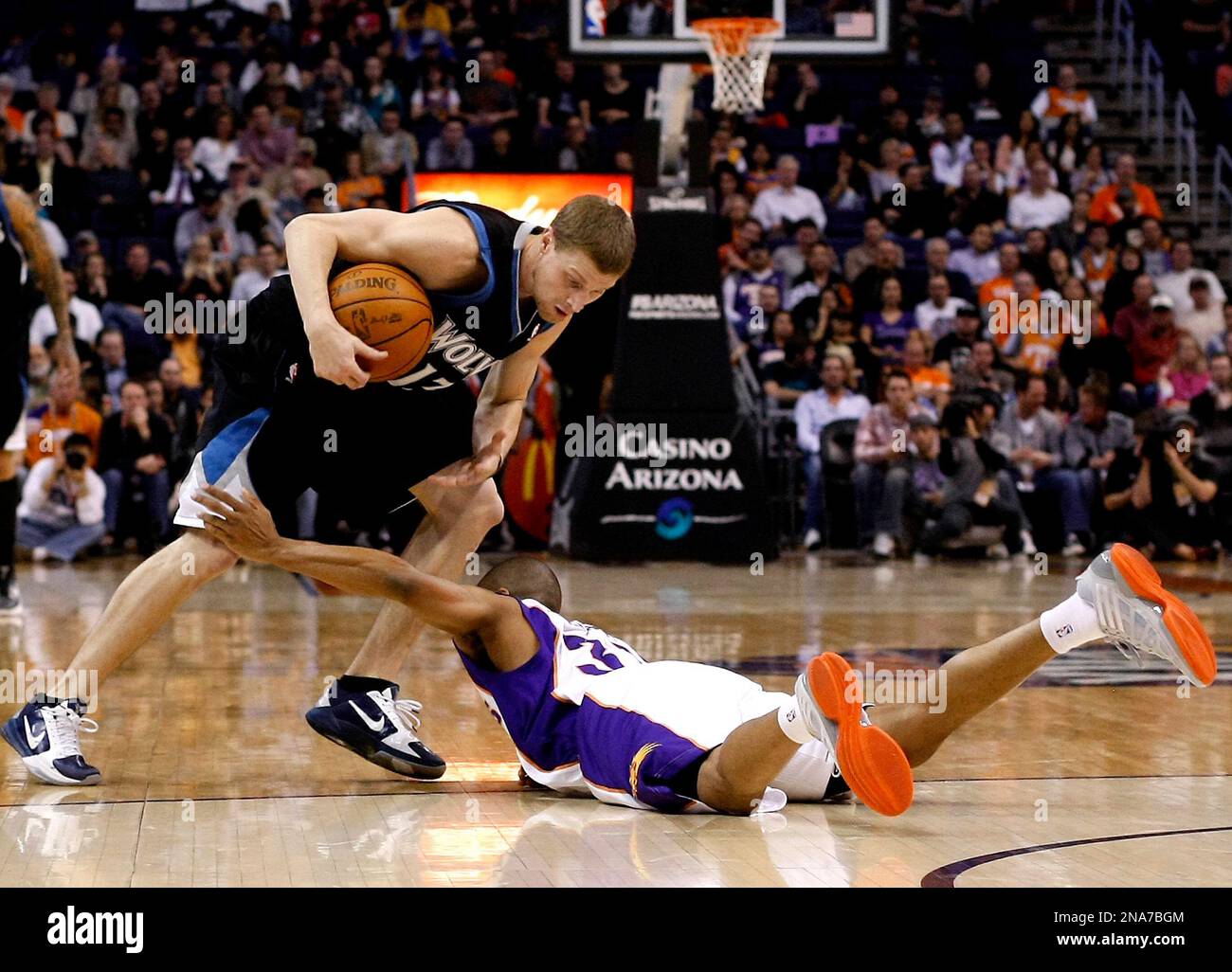 Minnesota Timberwolves guard Luke Ridnour, left, battles for control of ...
