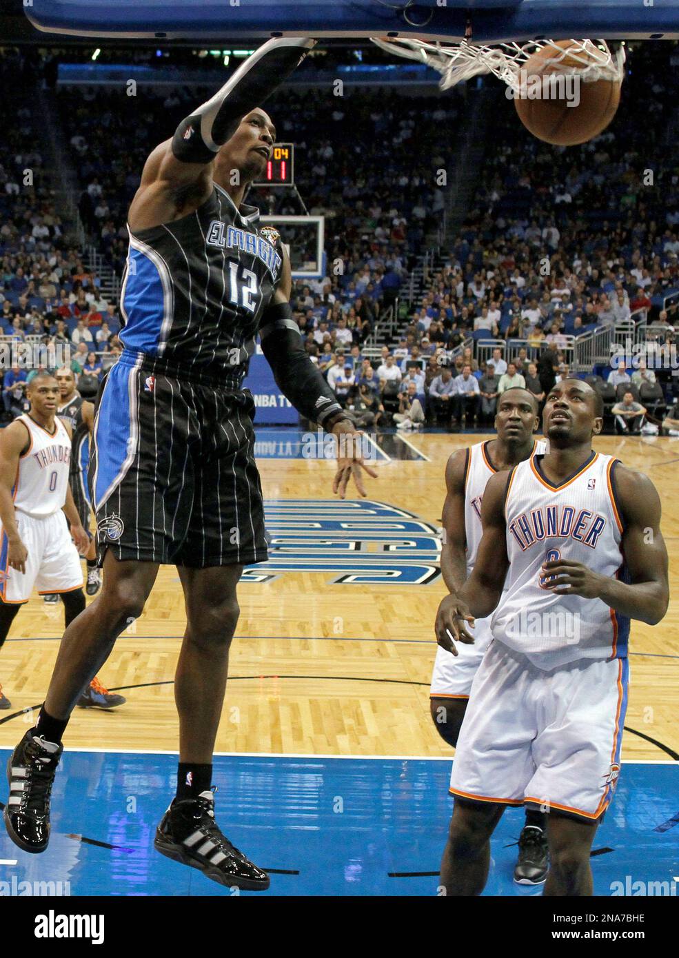 Orlando Magic's Dwight Howard (12) dunks the ball in front of Oklahoma ...