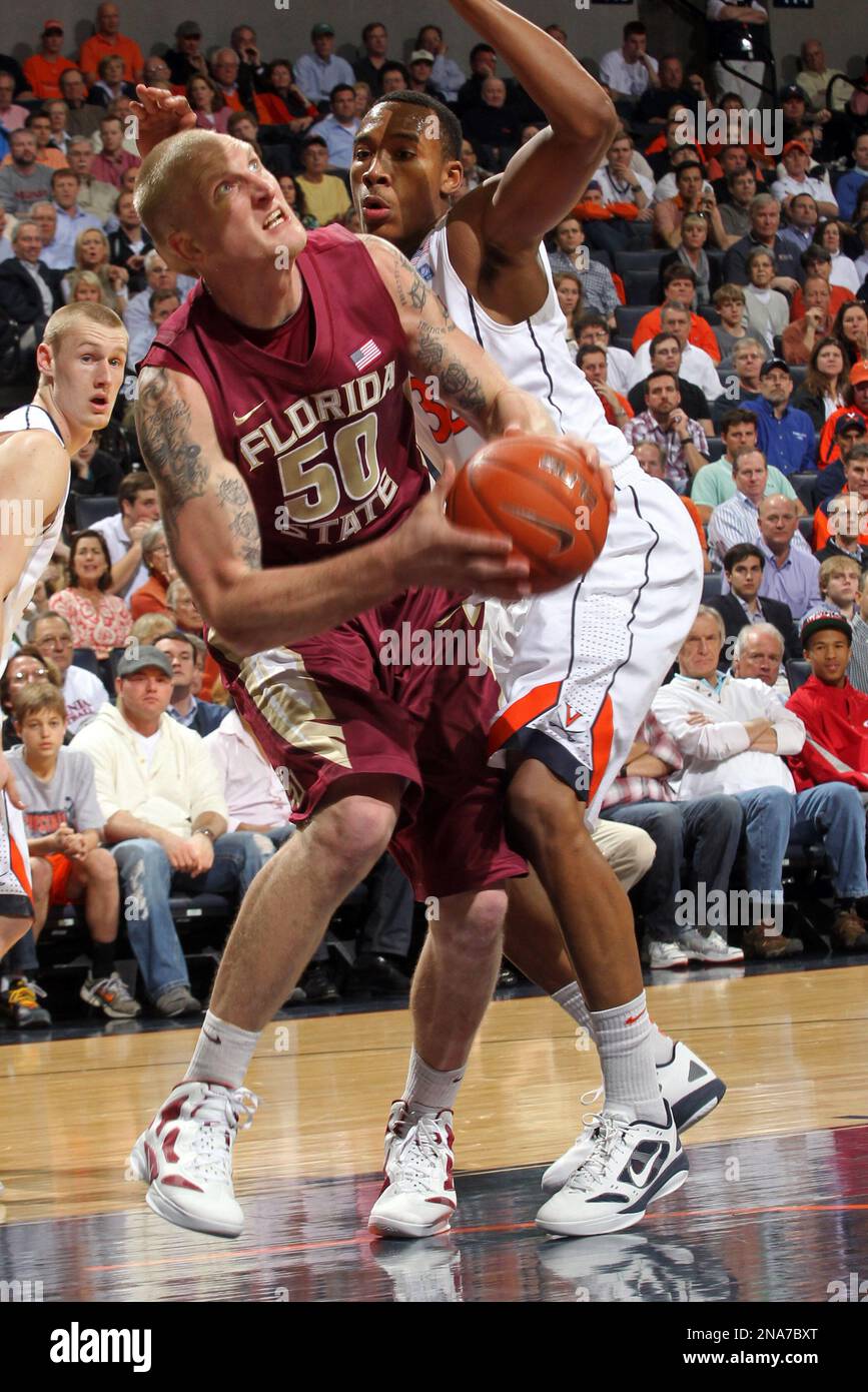 Florida State center Jon Kreft (50) looks for a shot next to Virginia forward Darion Atkins (32 ...