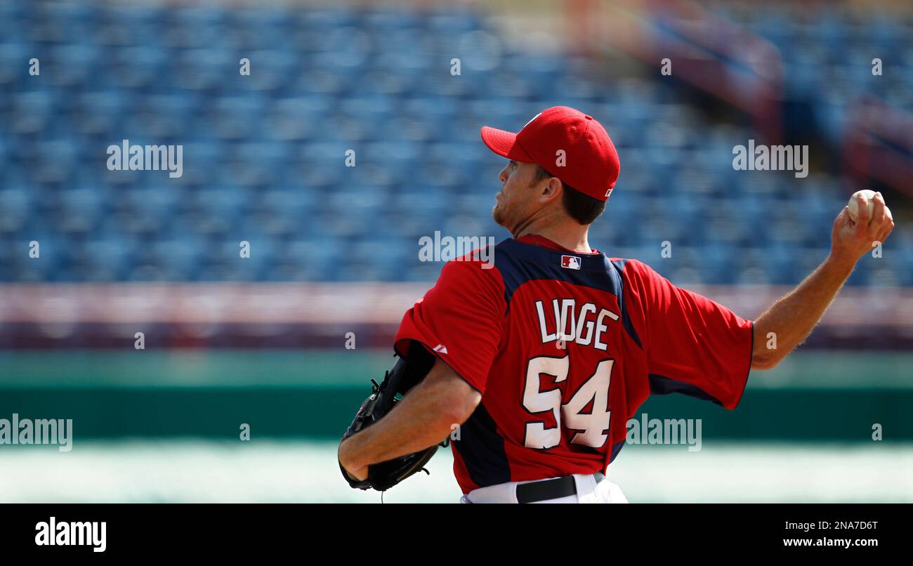 Washington Nationals pitcher Brad Lidge throws during spring training ...