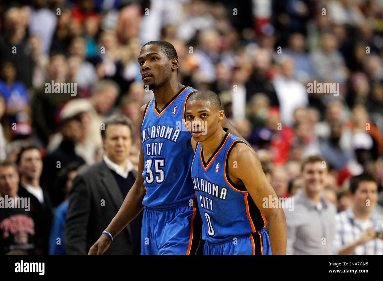 Oklahoma City Thunder's Kevin Durant, left, reacts with Russell ...