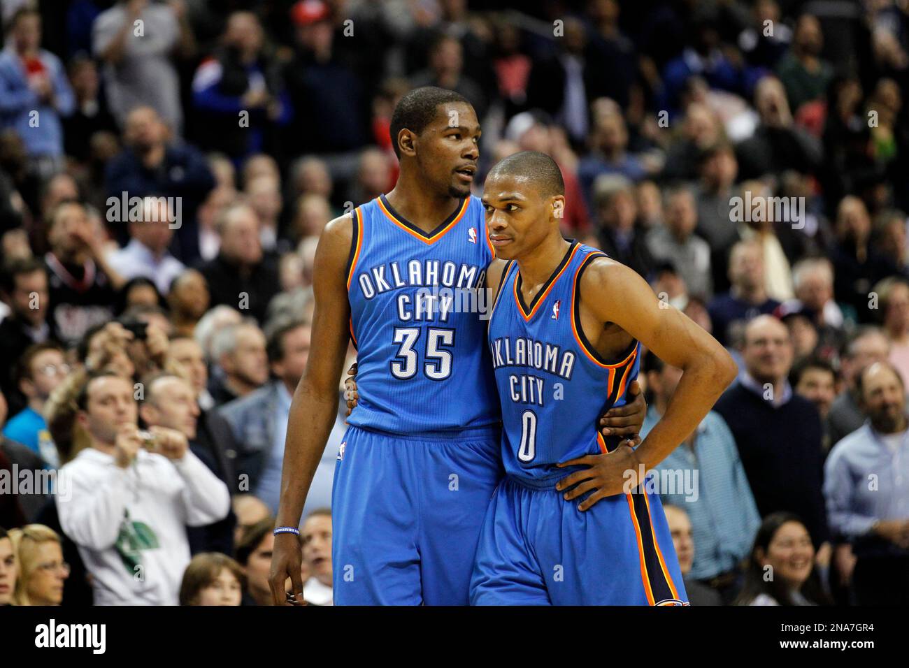 Oklahoma City Thunder's Kevin Durant, left, reacts with Russell ...