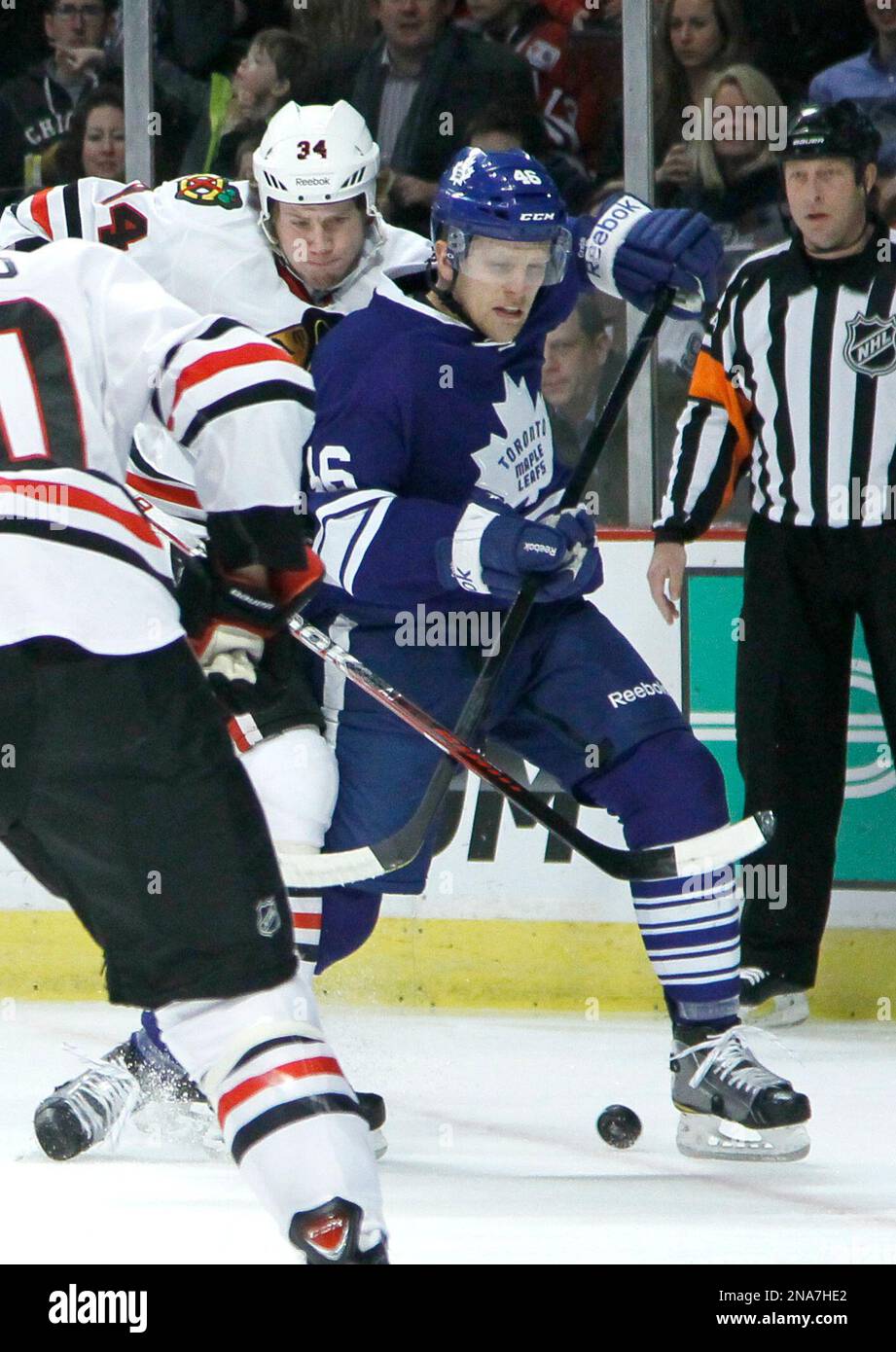 Toronto Maple Leafs right wing Joey Crabb (46) is challenged by Chicago ...