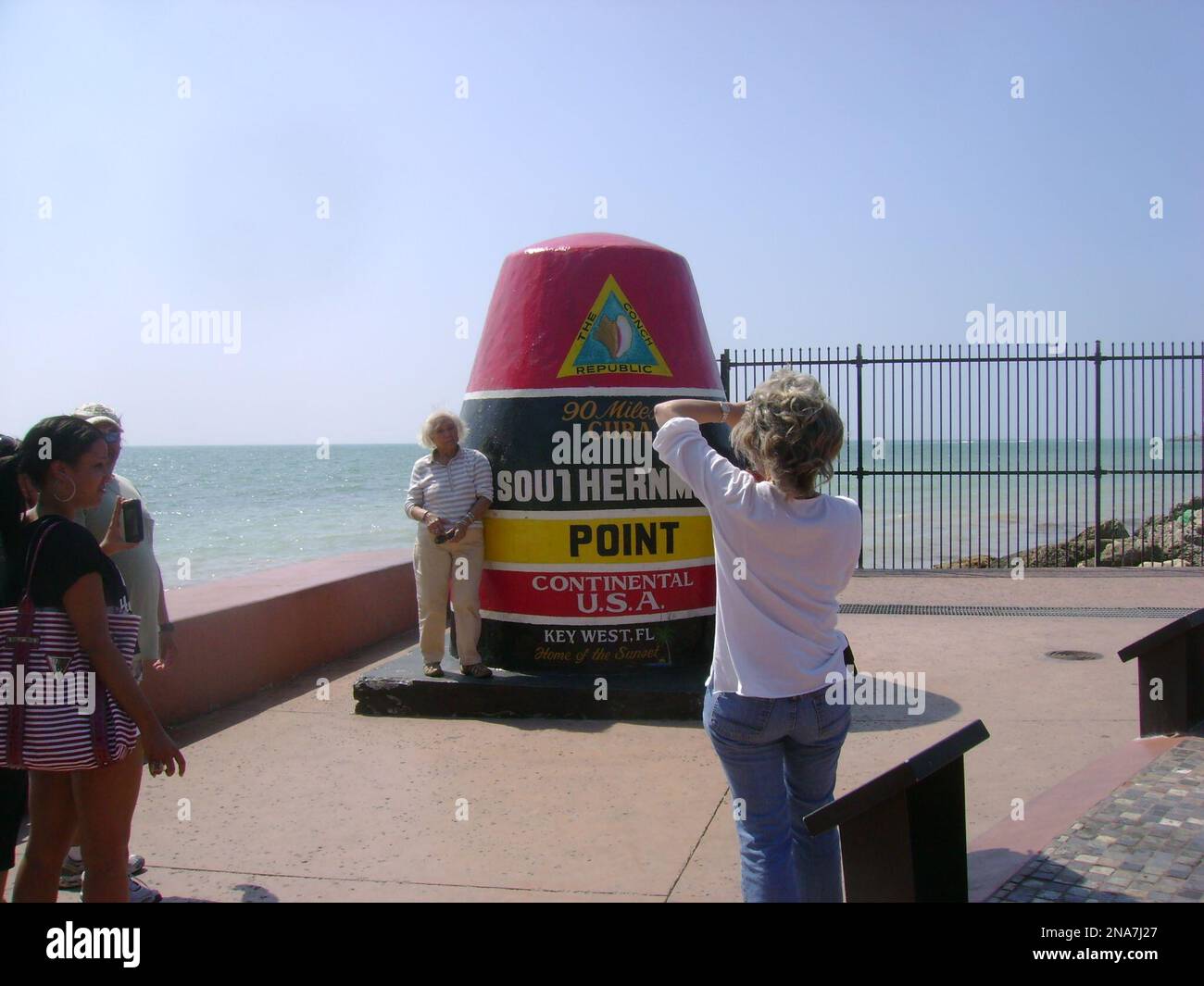 In this February 2012 photo, a tourist poses for a pictures at the ...