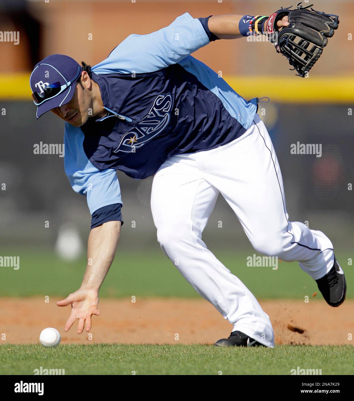 Tampa Bay Rays' Sean Rodriguez fields a ball during a baseball spring ...
