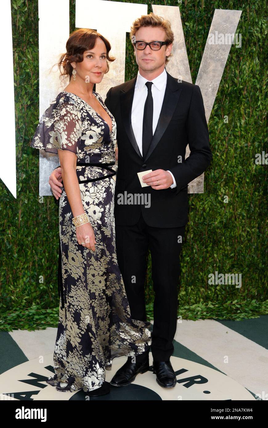 Actor Simon Baker and wife Rebecca Rigg arrive at the Vanity Fair Oscar ...
