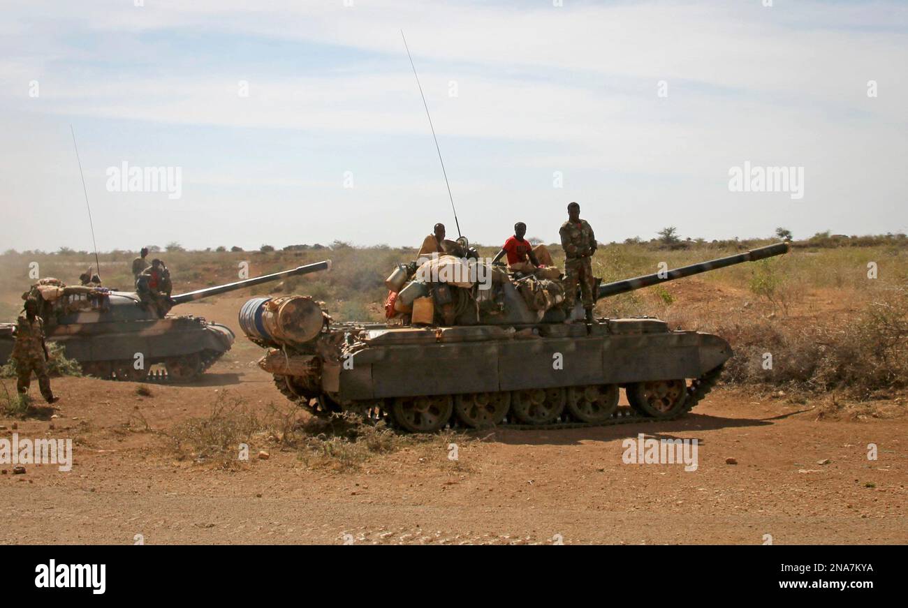 Ethiopian military tanks sit in position on the outskirts of the town ...